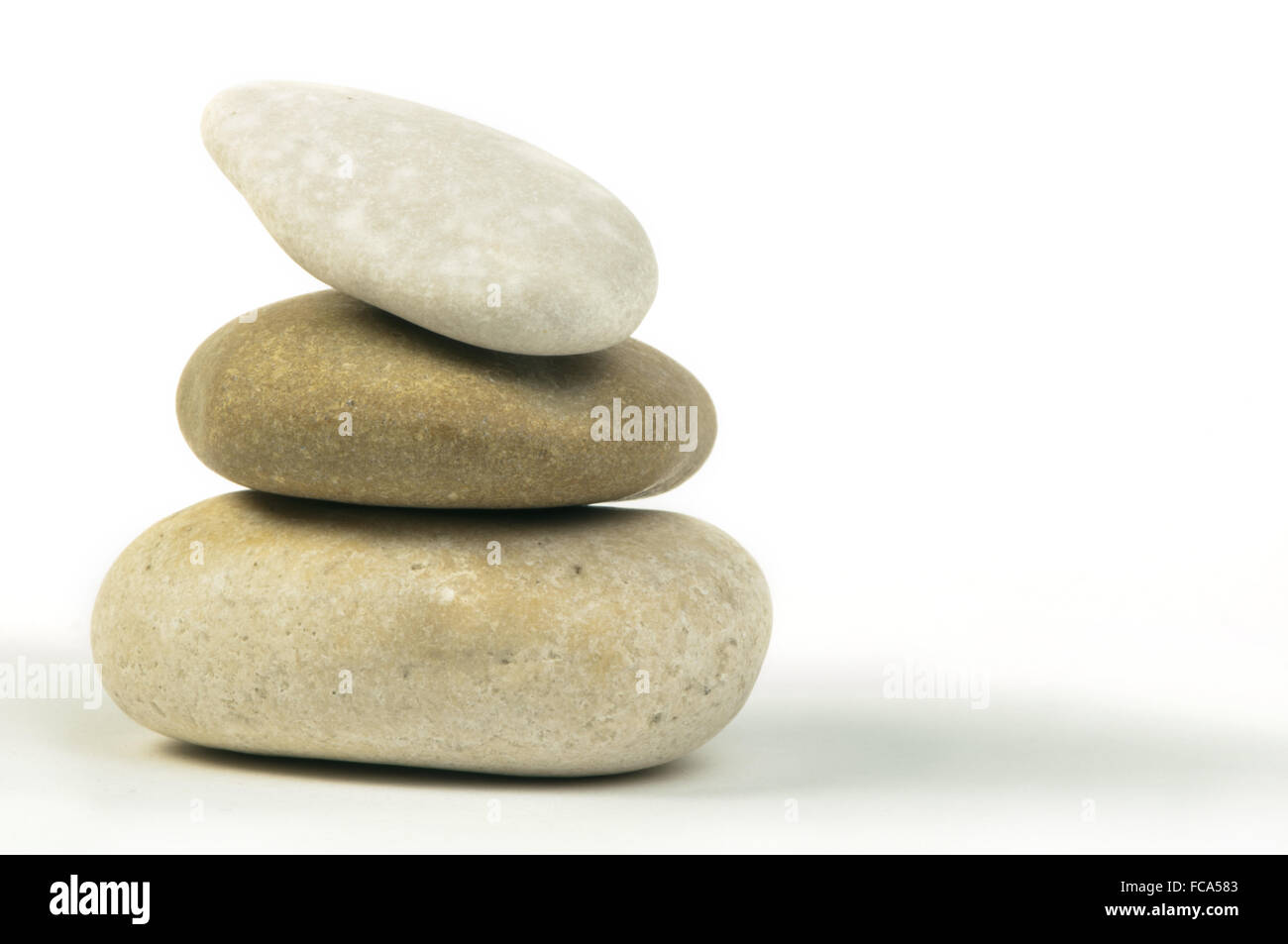 Stacked stones white isolated Stock Photo - Alamy