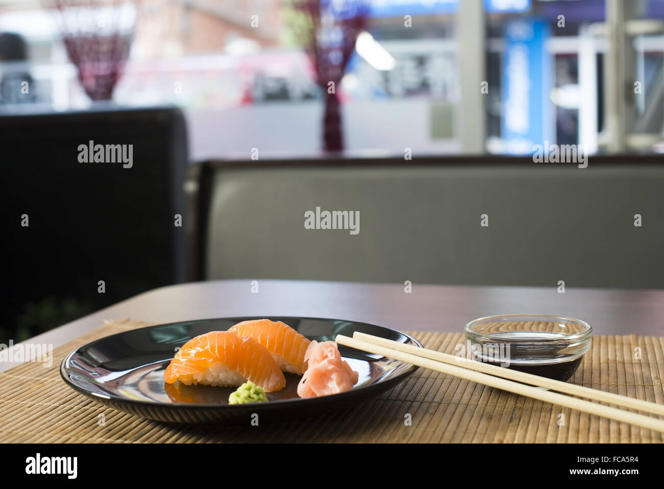 Sushi in sushi bar Stock Photo - Alamy