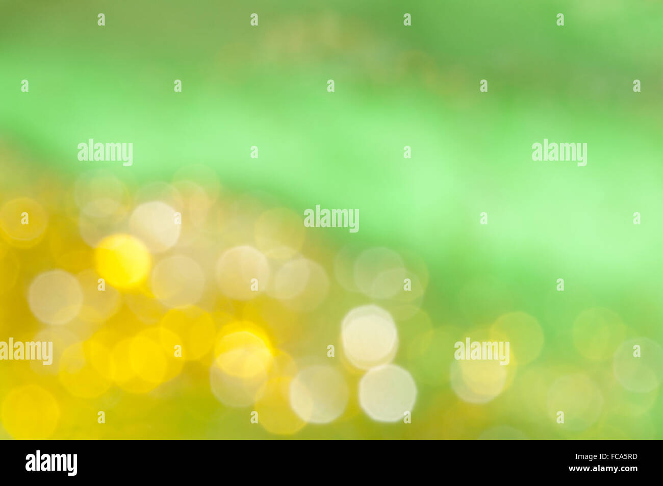 Holiday shiny blurry lights in yellow colors Stock Photo - Alamy