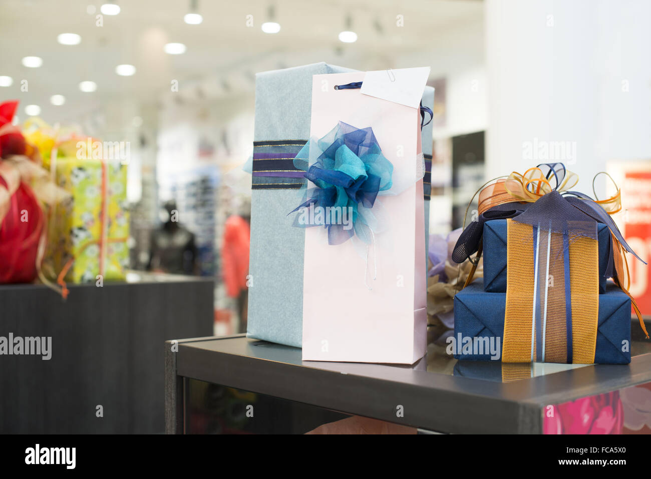 Gift boxes in shopping center Stock Photo - Alamy