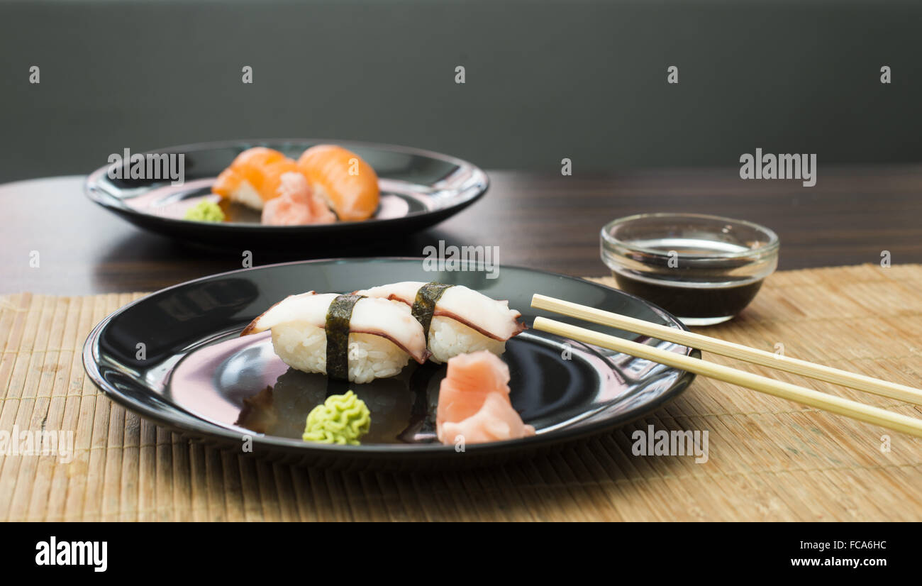 Sushi in sushi bar Stock Photo - Alamy