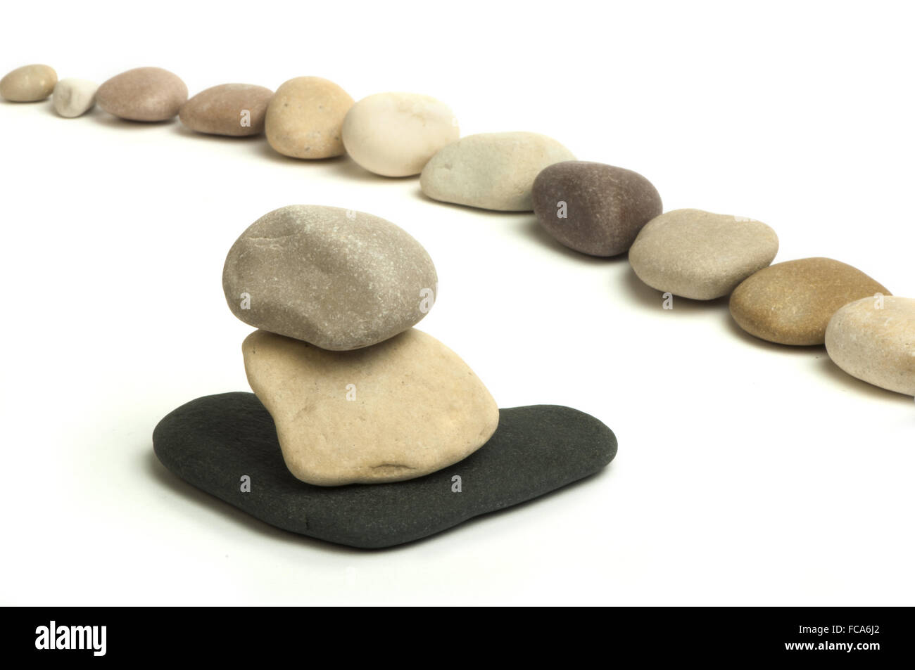 Stacked stones white isolated Stock Photo - Alamy