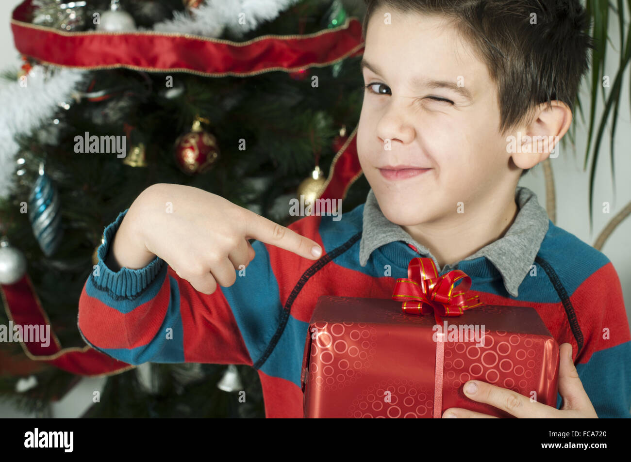 Boy points out his gift on Christmas Stock Photo - Alamy