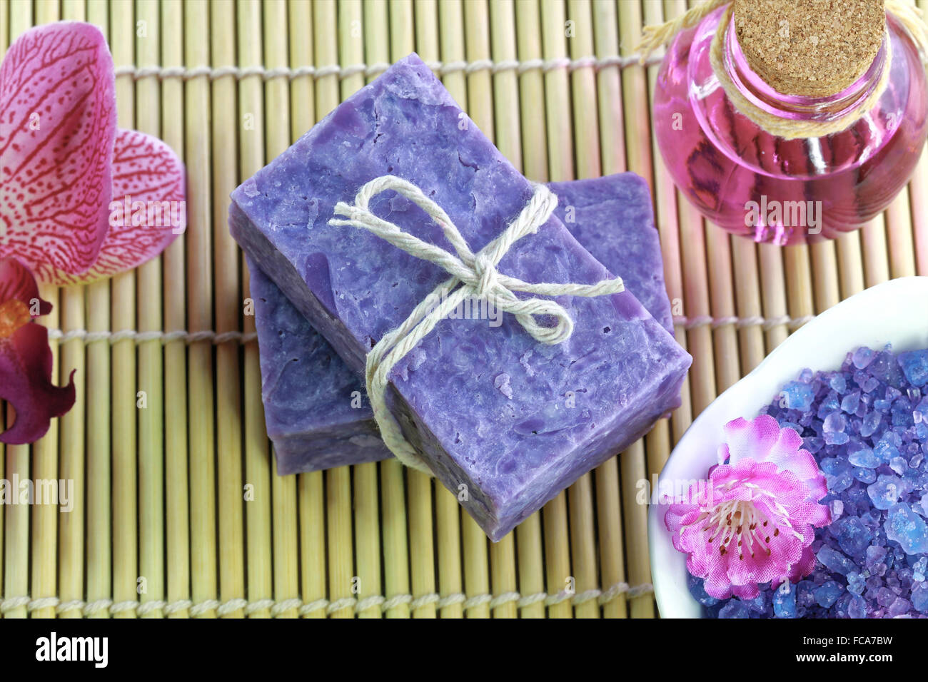 Spa treatment setting with purple theme Stock Photo - Alamy