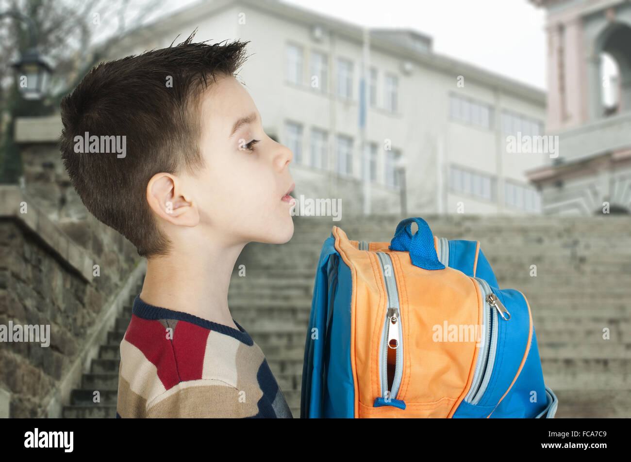 Boy with schoolbag Stock Photo - Alamy