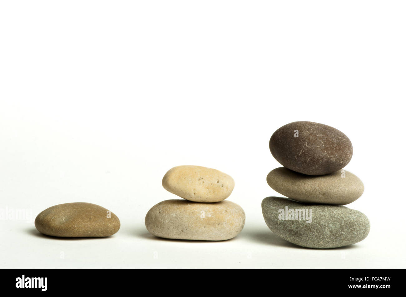 Stacked stones white isolated Stock Photo - Alamy