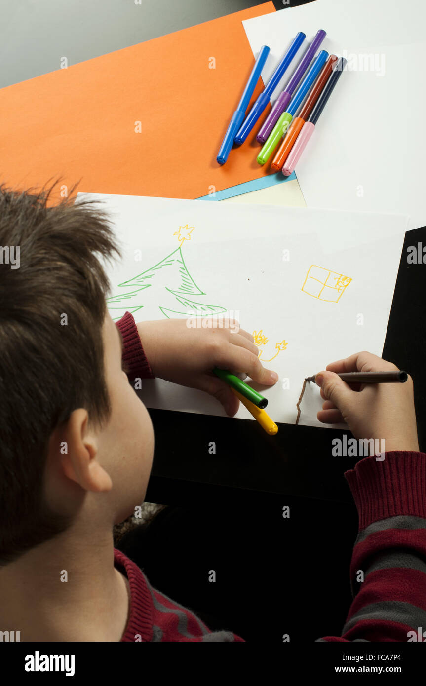 Boy drawing with markers Stock Photo - Alamy
