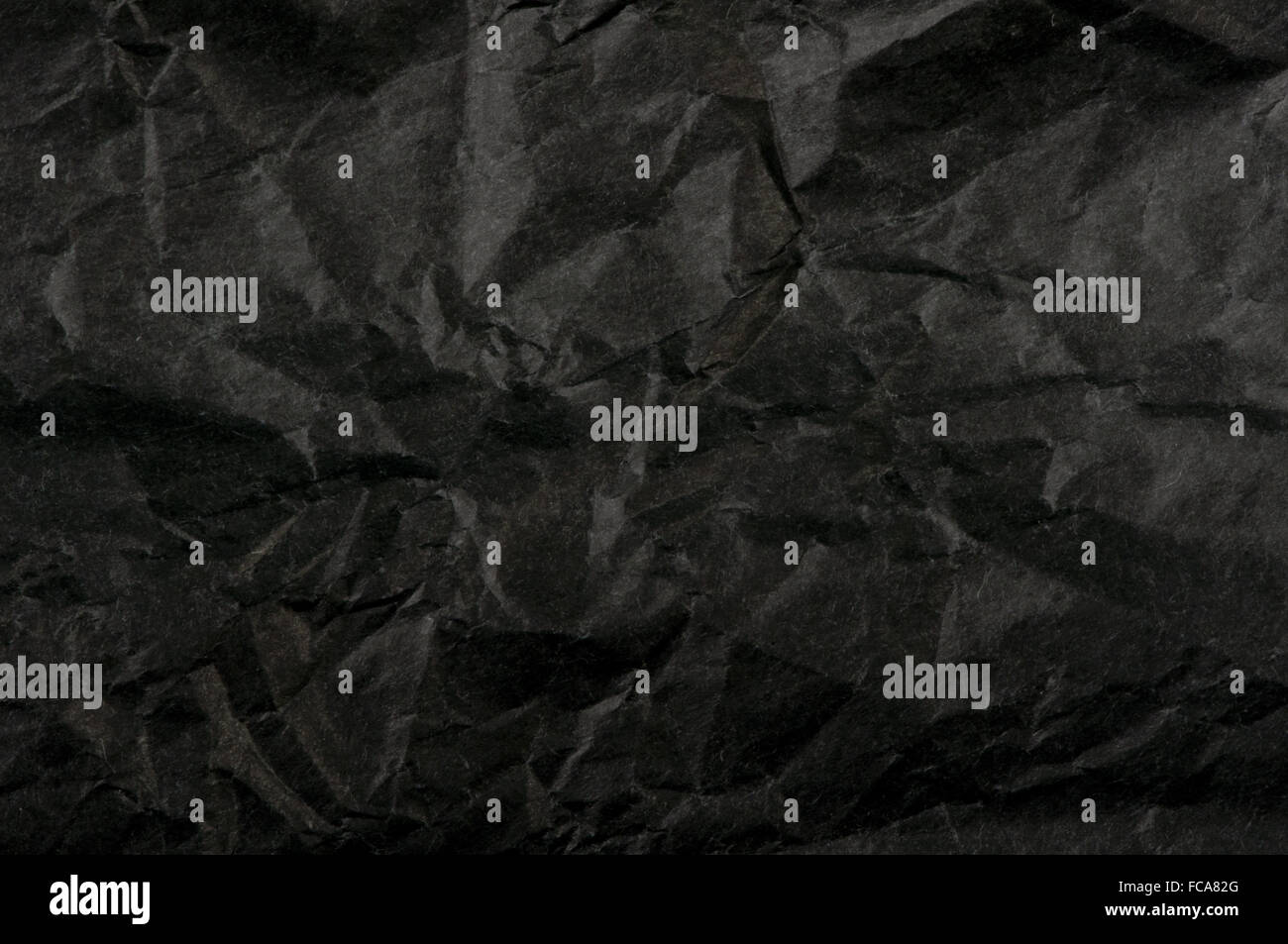 Crumpled black paper Stock Photo - Alamy
