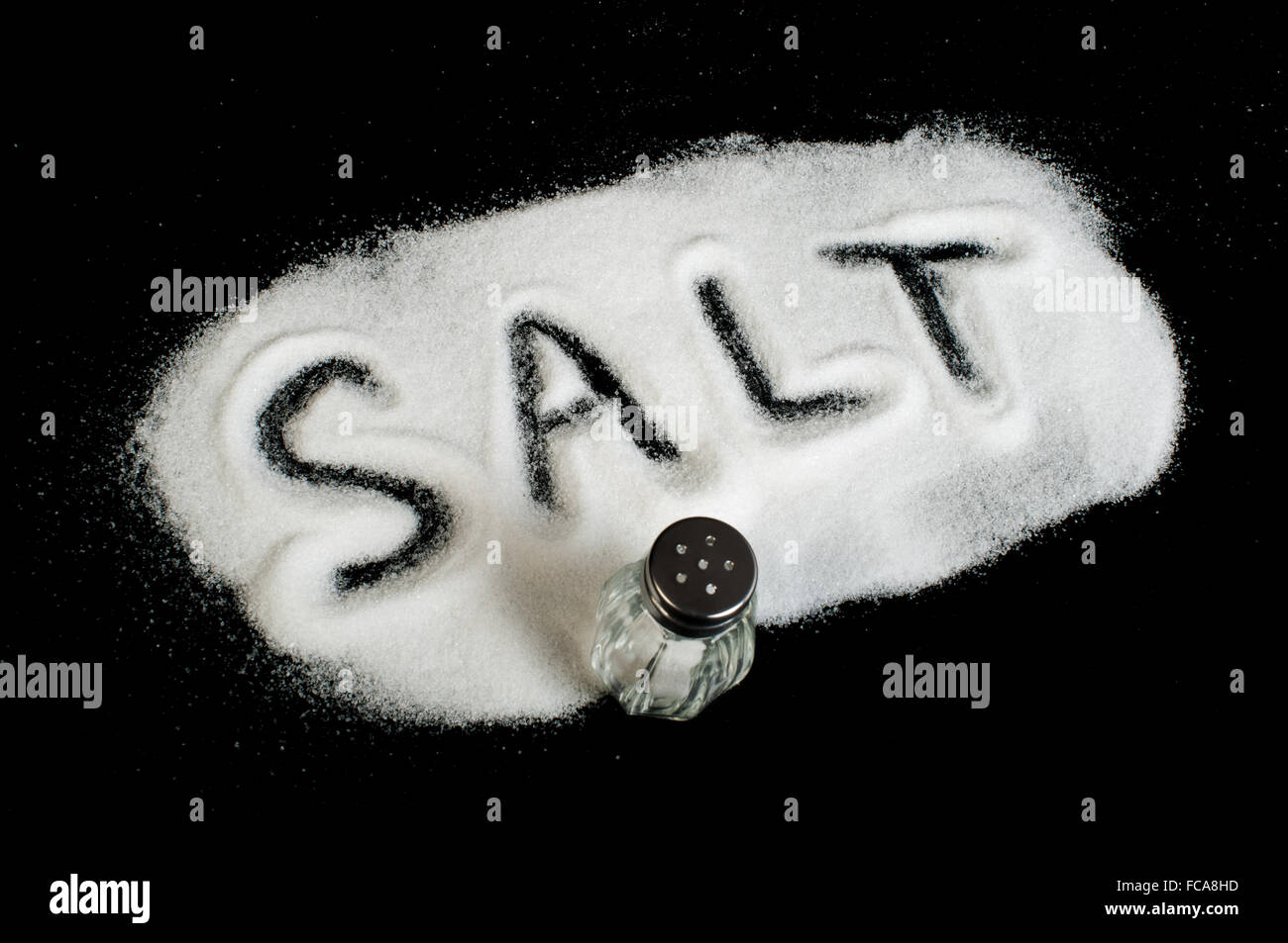 Word Salt on black background Stock Photo - Alamy