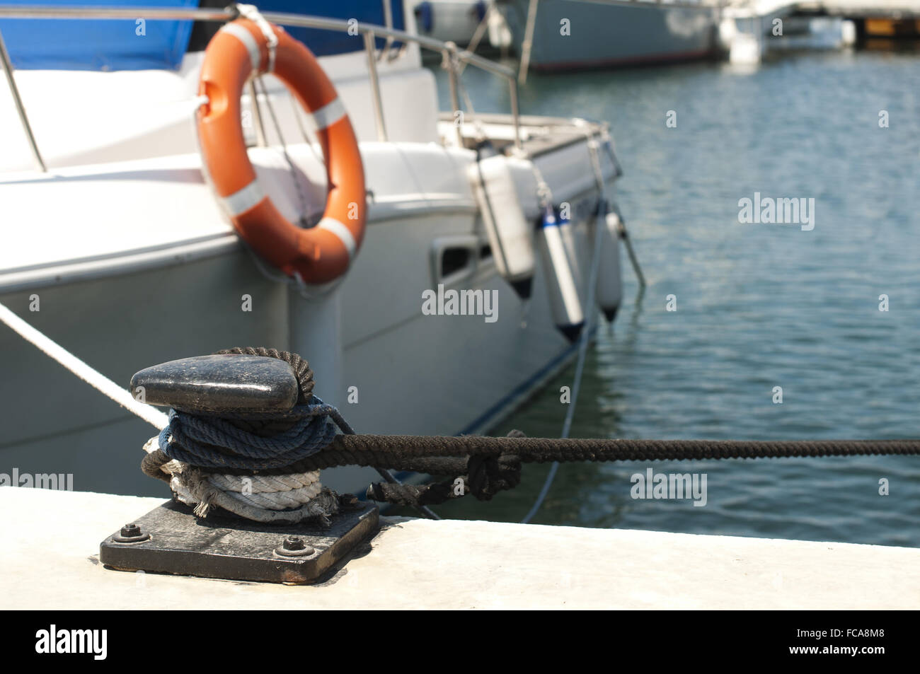 Yacht docked in harbor Stock Photo - Alamy