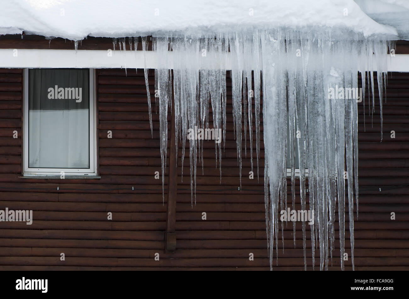 Icicles on window Stock Photo - Alamy