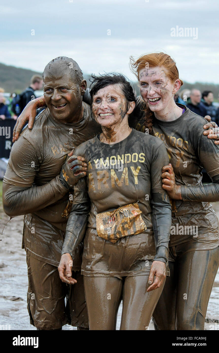 Portrait of mud covered male and female runners at obstacle course race, UK Stock Photo - Alamy