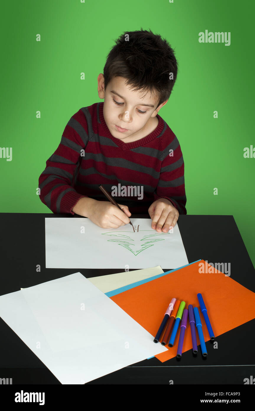 Boy drawing with markers Stock Photo - Alamy