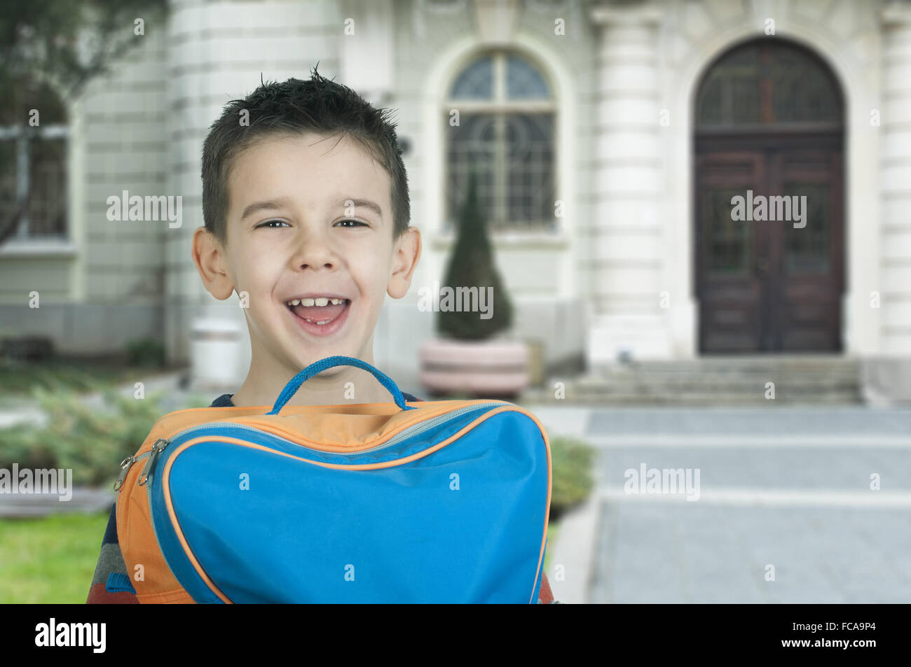 Boy with schoolbag Stock Photo - Alamy