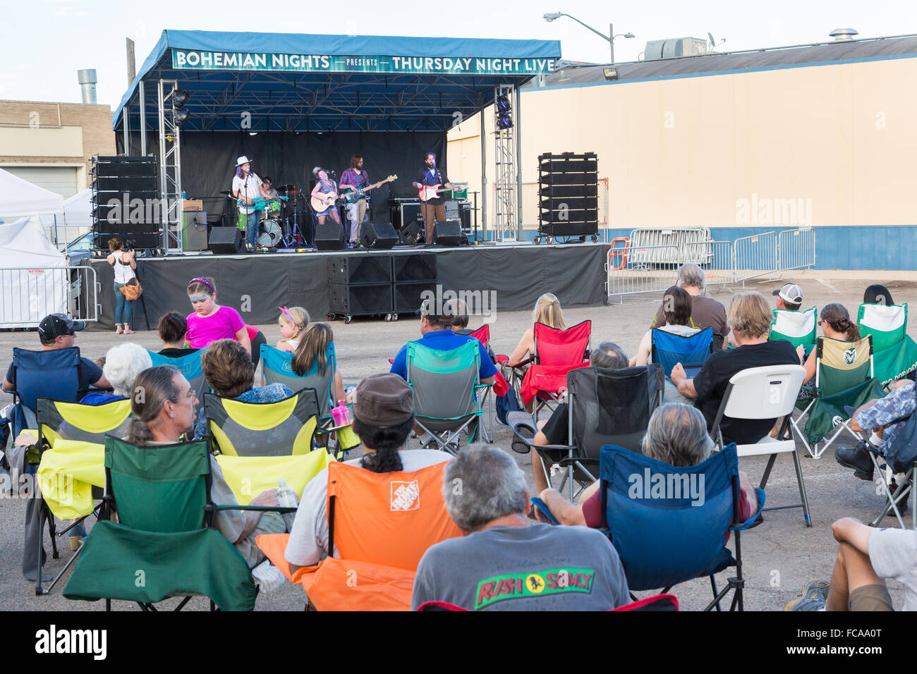 People gather to listen to a free concert during Bohemian Nights on ...