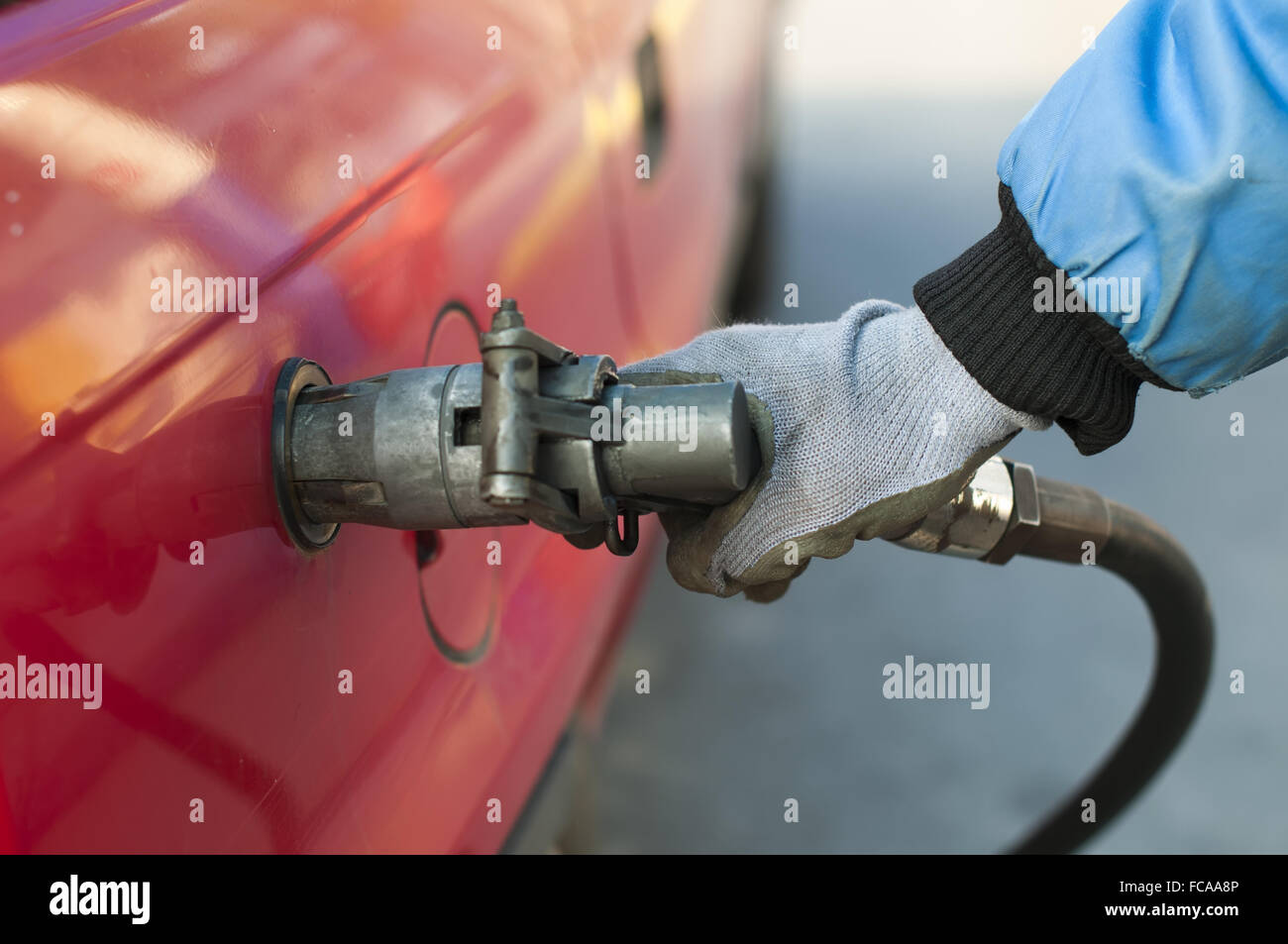 Loading a car with gas Stock Photo - Alamy