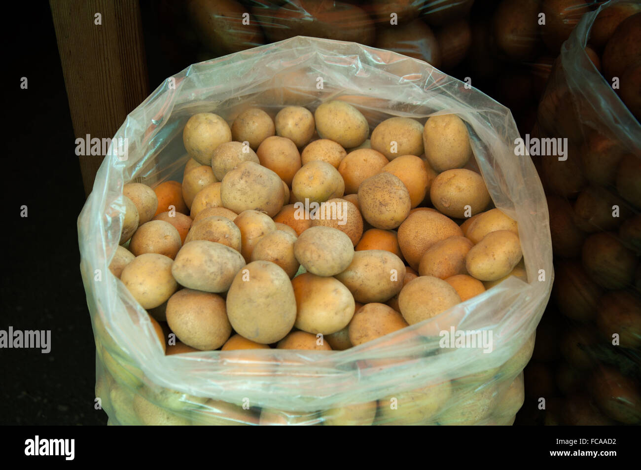 Potatoes in bag Stock Photo - Alamy