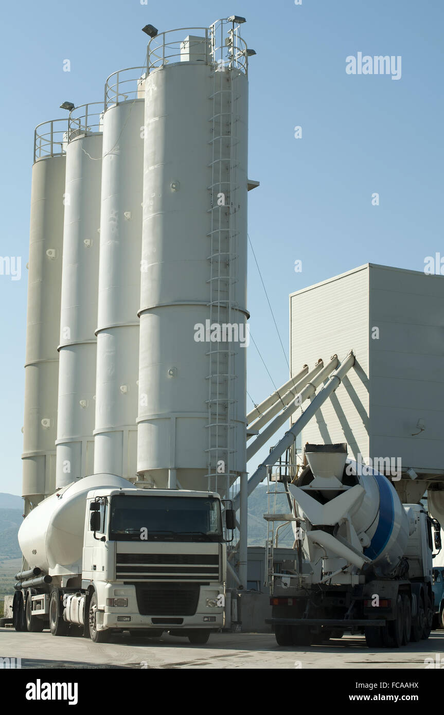 Cement factory and a truck loading cement Stock Photo - Alamy