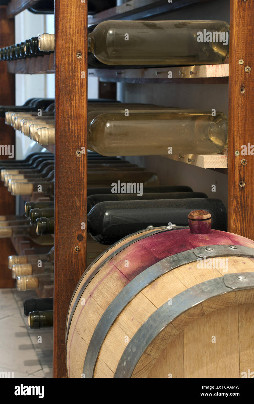 A little wine barrel and bottles wine Stock Photo - Alamy