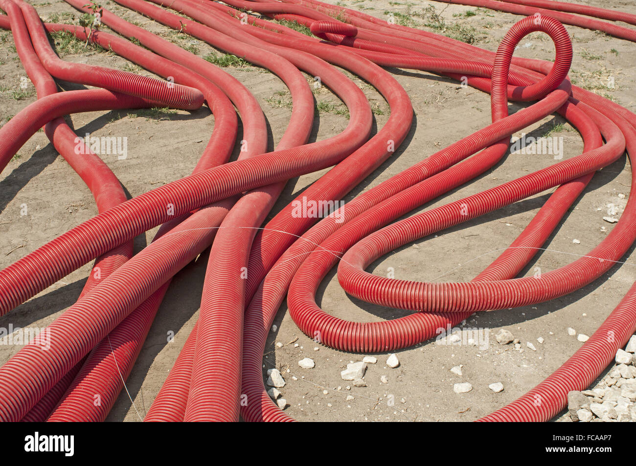 Red braided and turned tubes Stock Photo - Alamy