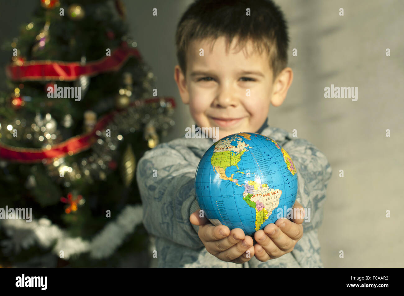 Child who give as gift the world Stock Photo - Alamy