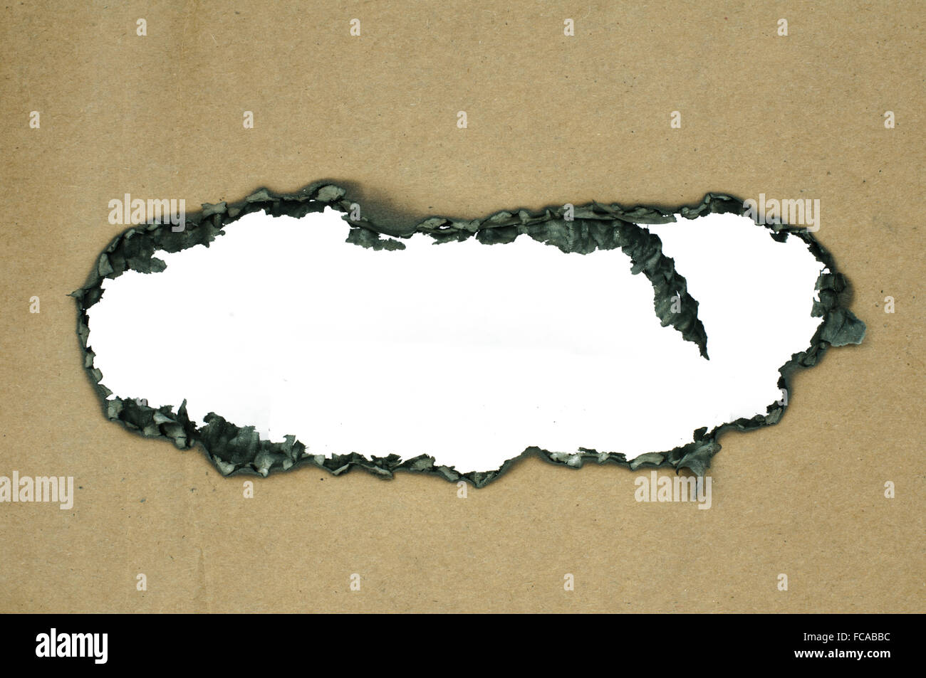 Burned paper and hole Stock Photo - Alamy