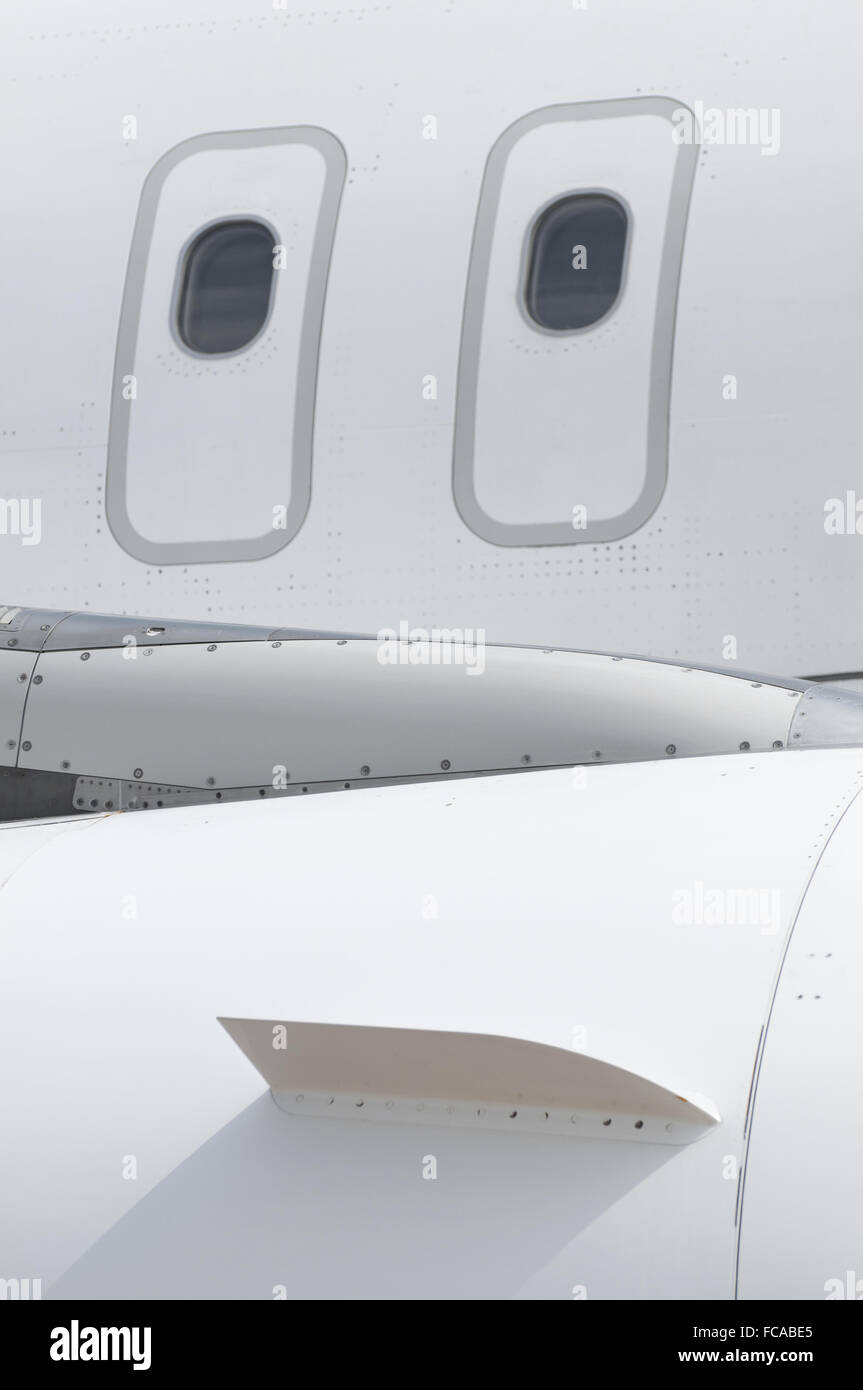 Windows of an airplane outside Stock Photo - Alamy