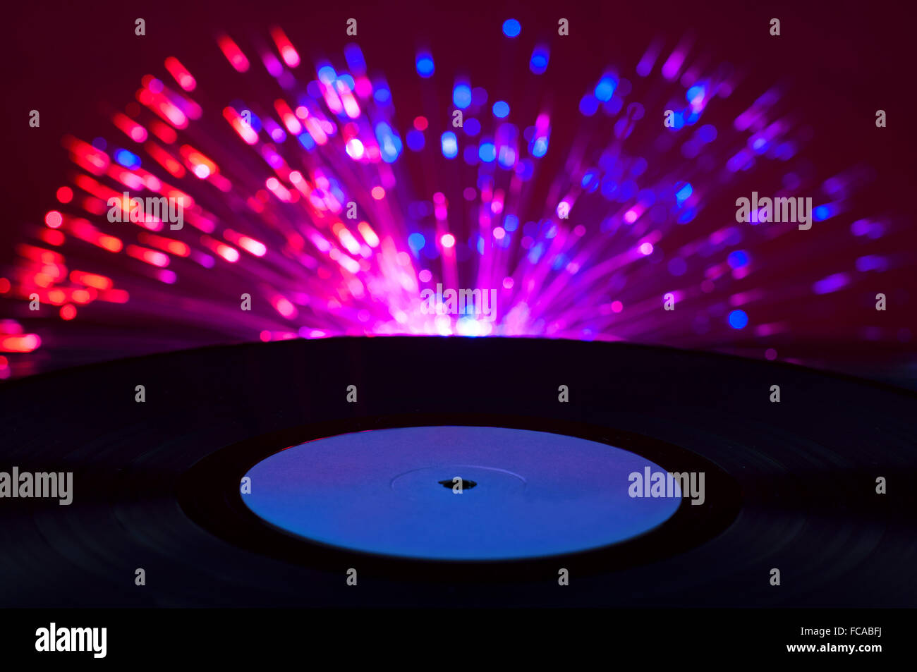 LP vinyl record and disco lights Stock Photo - Alamy