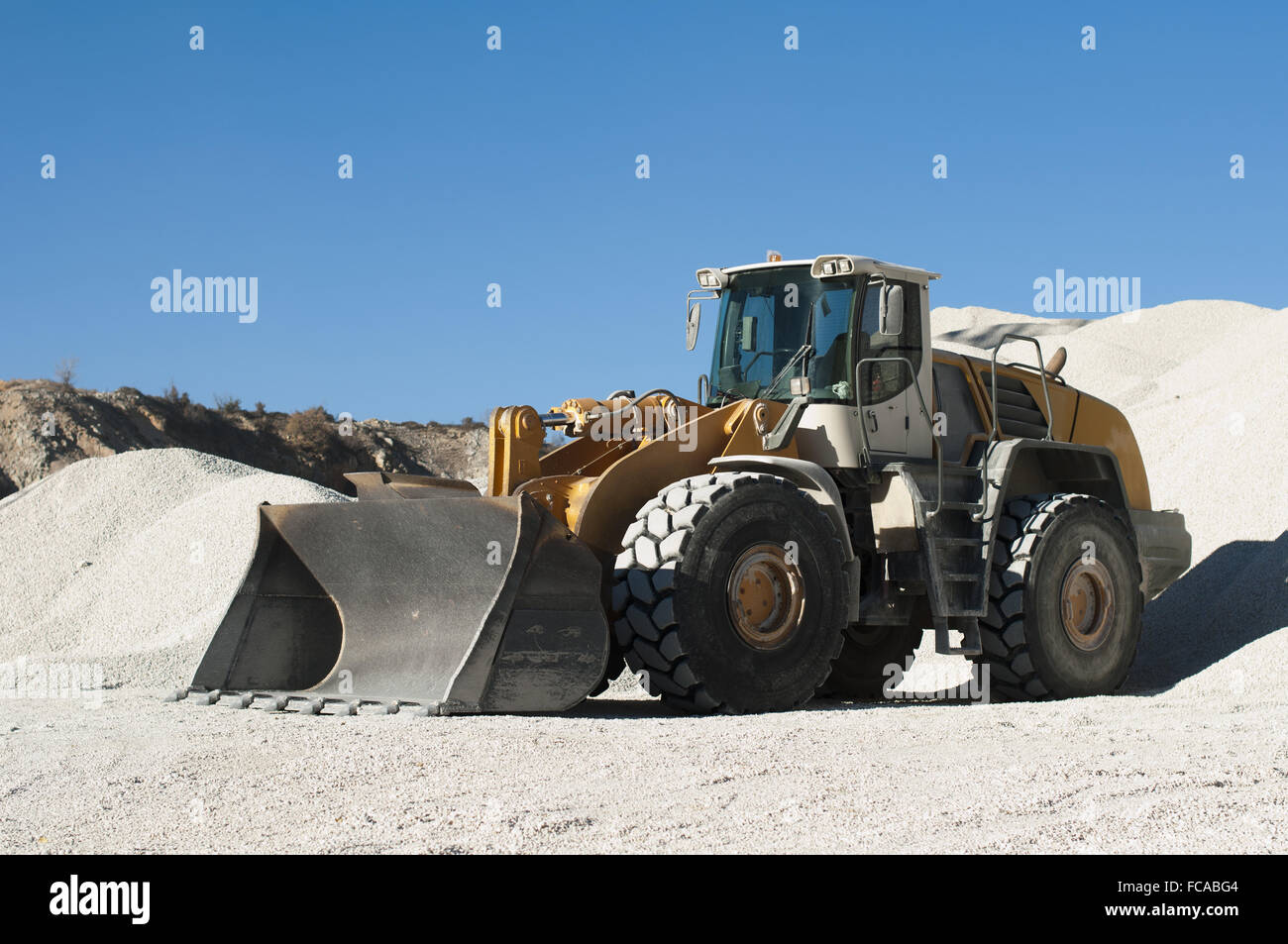 Excavator in a limestone quarry Stock Photo - Alamy