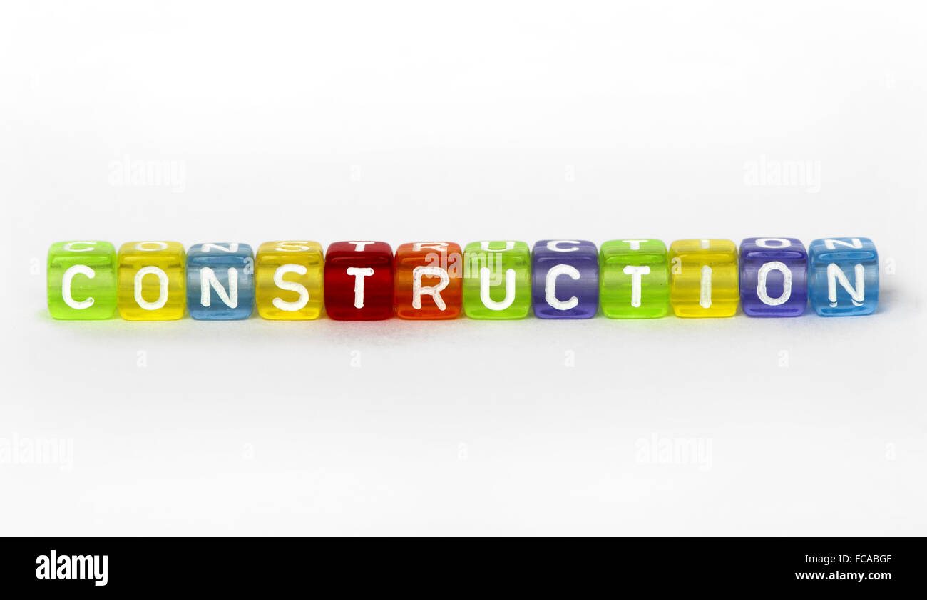 Text construction on colorful wooden cubes Stock Photo - Alamy