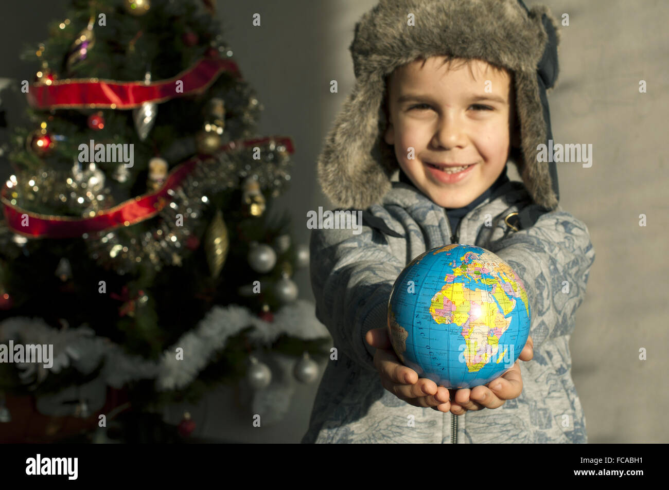 Child who give as gift the world Stock Photo - Alamy