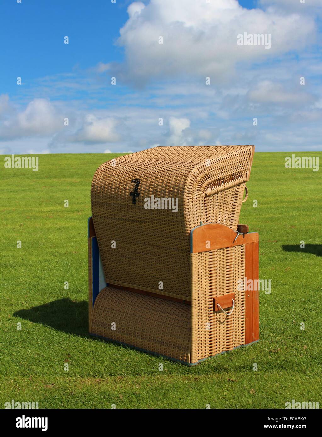 Beach chair at the dyke Stock Photo - Alamy