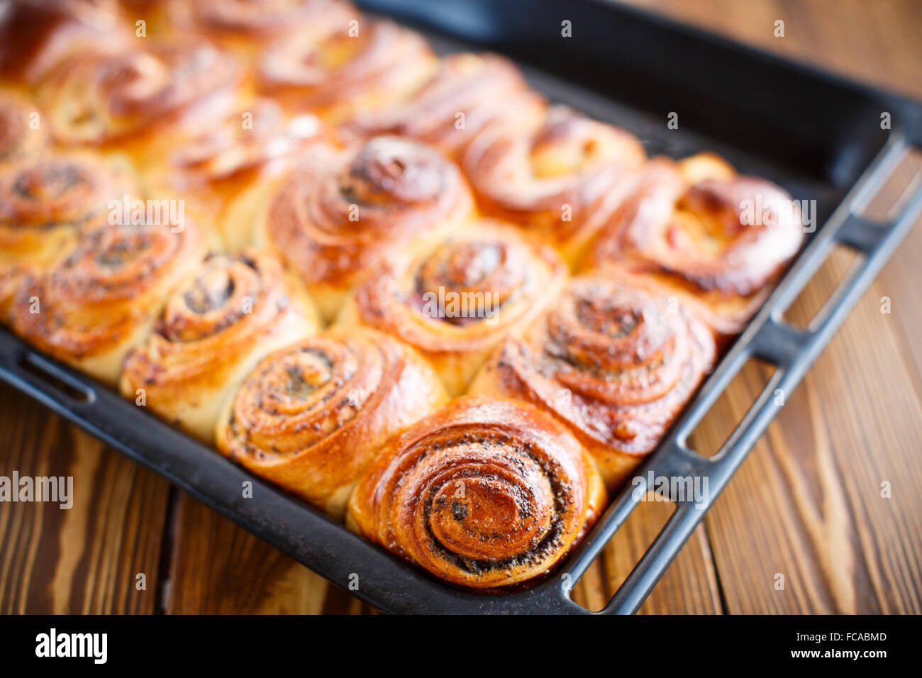 twisted bun with poppy seeds Stock Photo - Alamy