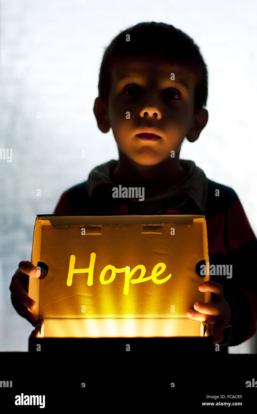 Child and box shine light Stock Photo - Alamy