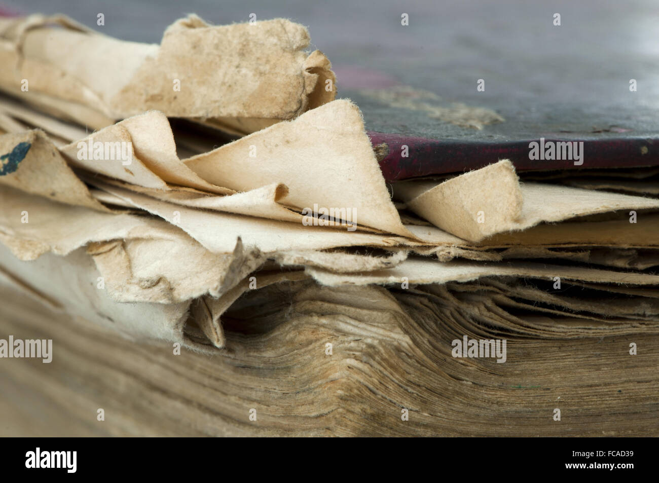 Old worn paper sheets of book Stock Photo - Alamy