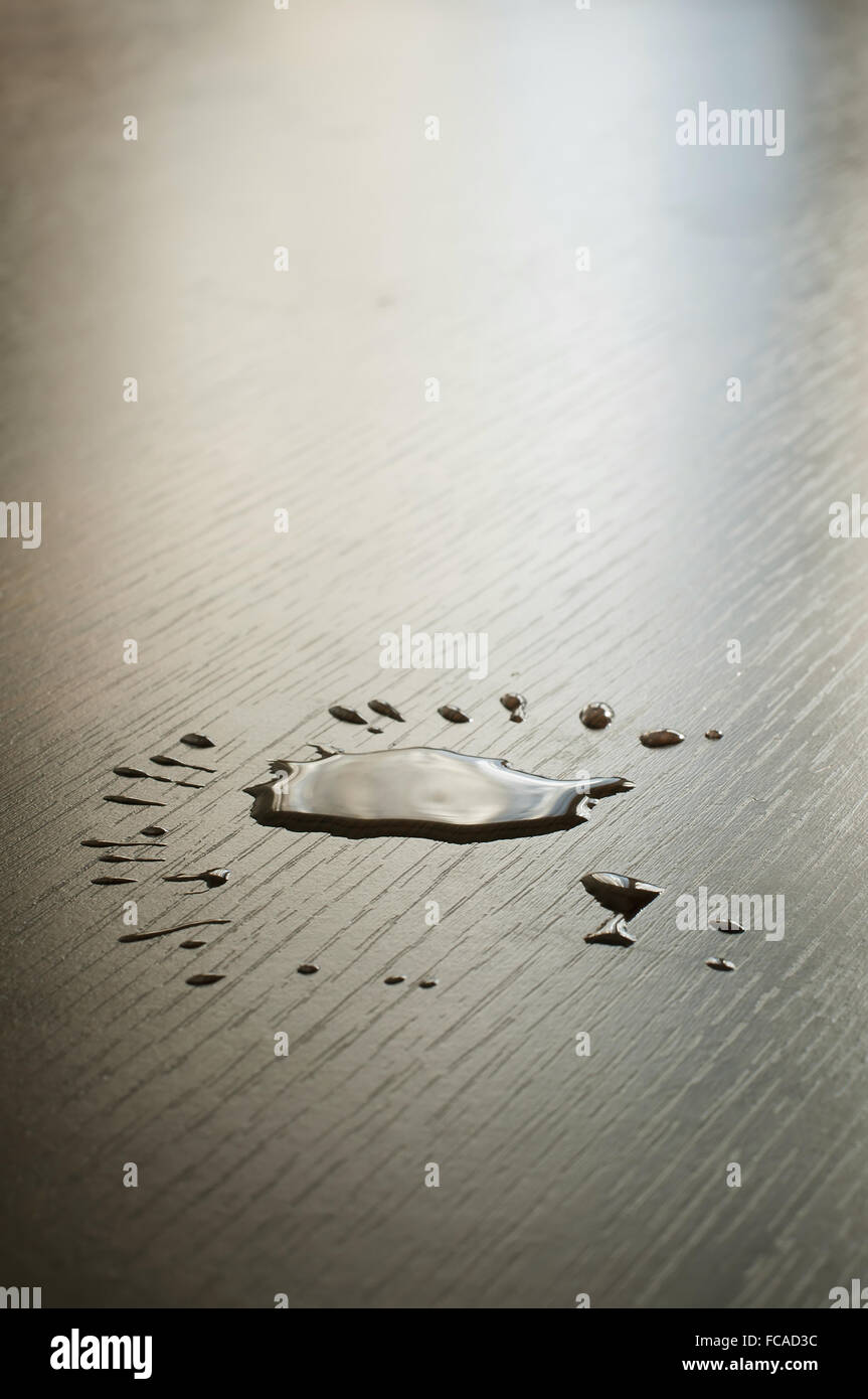 Spilled water on a table Stock Photo - Alamy
