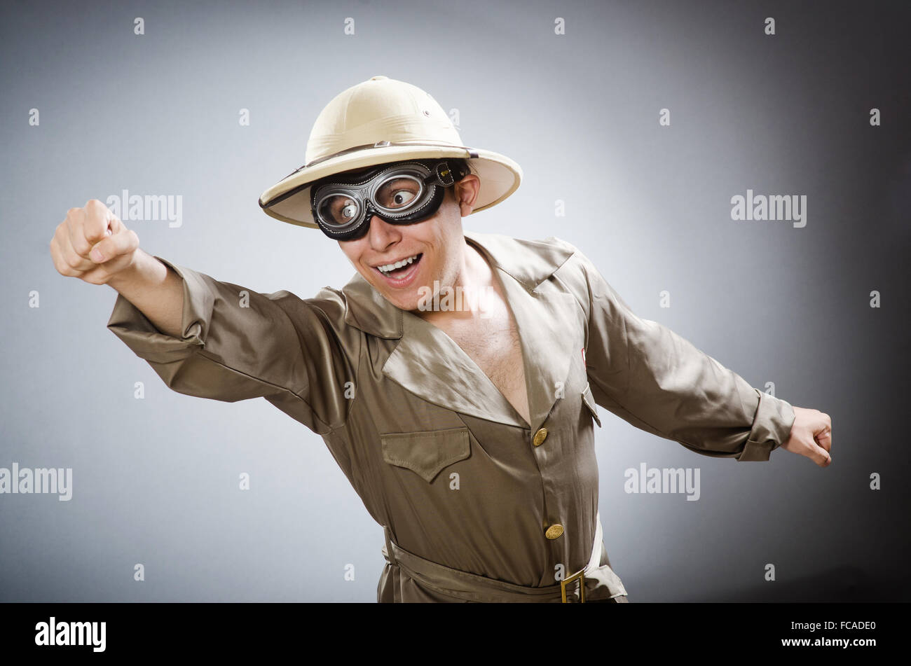 Funny safari traveller in travelling concept Stock Photo - Alamy