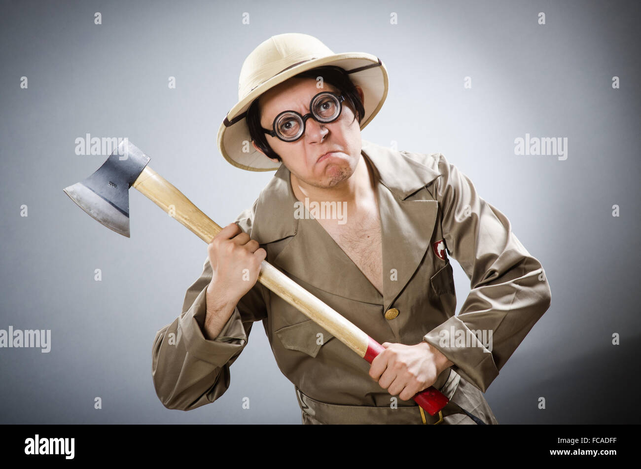 Funny safari traveller in travelling concept Stock Photo - Alamy