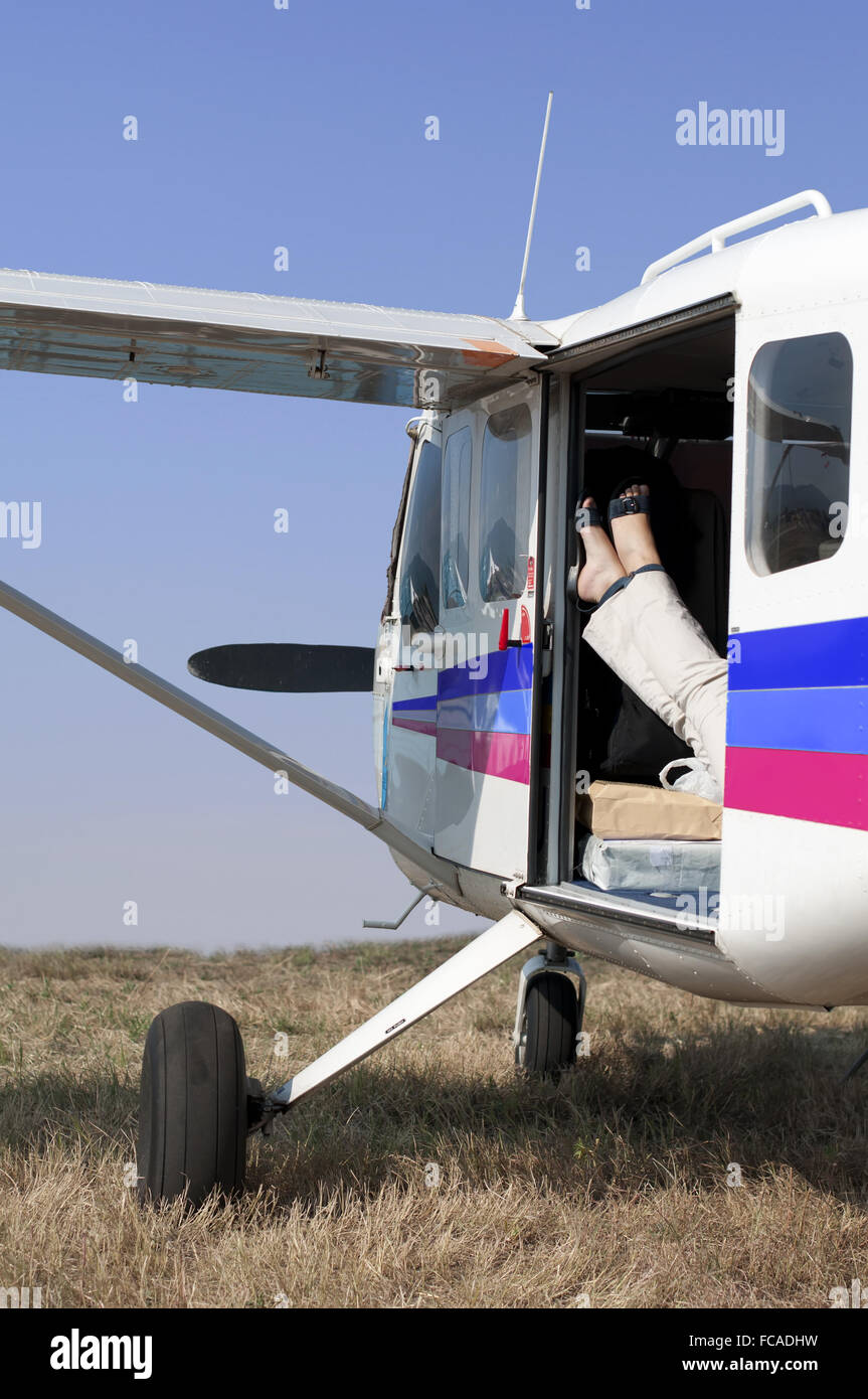 Female legs in a helicopter Stock Photo - Alamy