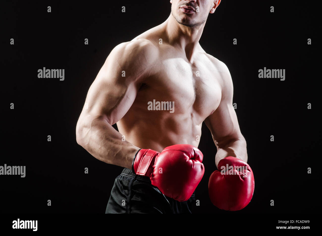 Muscular man in boxing concept Stock Photo - Alamy