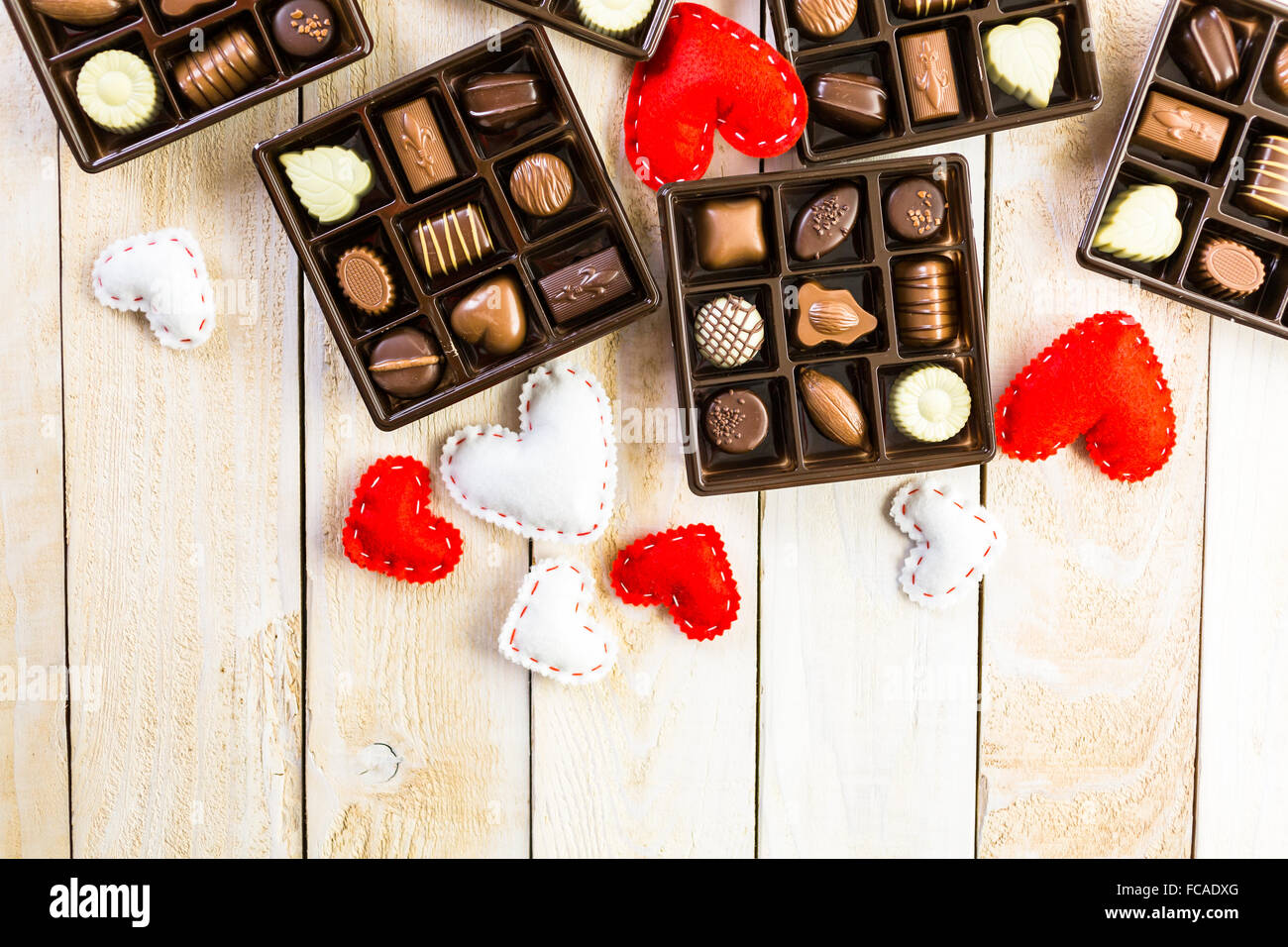 Assorted chocolates on wood table Stock Photo - Alamy