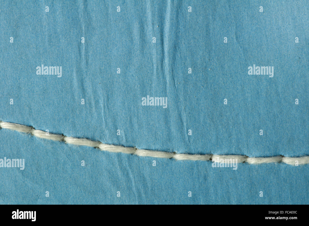 Blue paper seam Stock Photo - Alamy