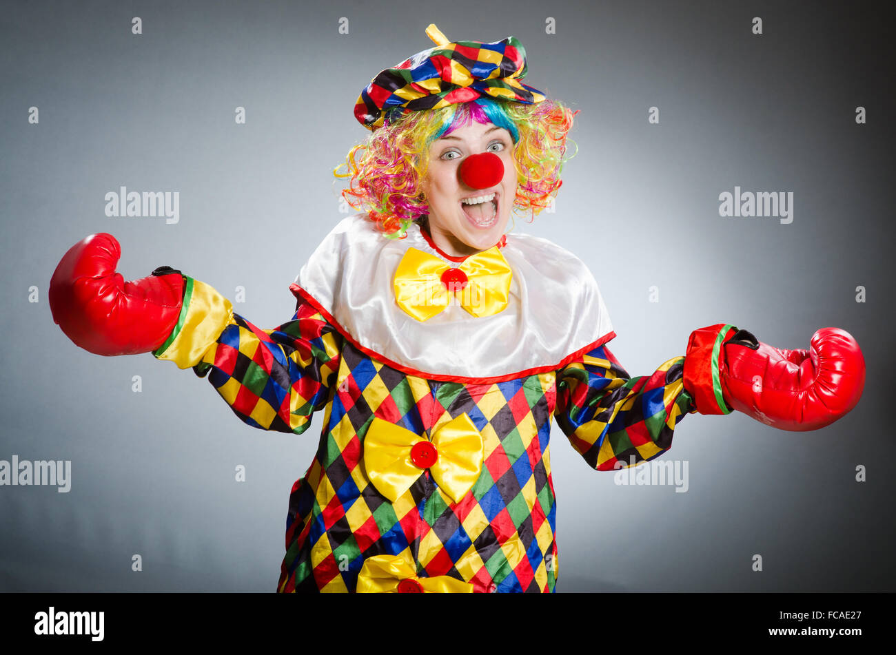 Funny clown in comical concept Stock Photo - Alamy