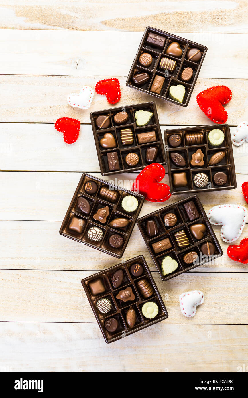 Assorted chocolates on wood table Stock Photo - Alamy