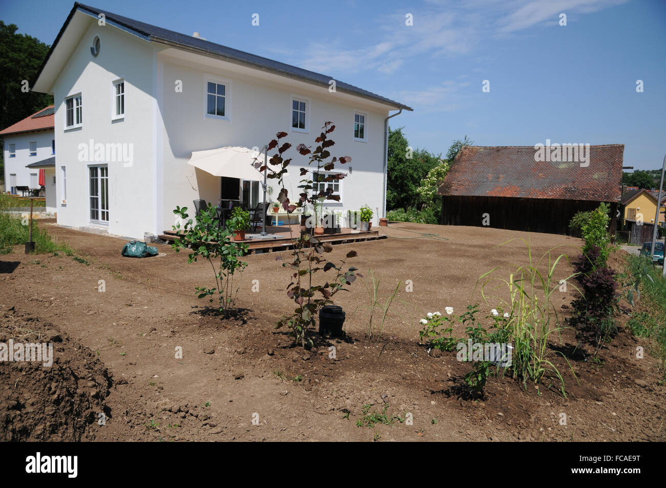 Building a garden, after planting Stock Photo - Alamy