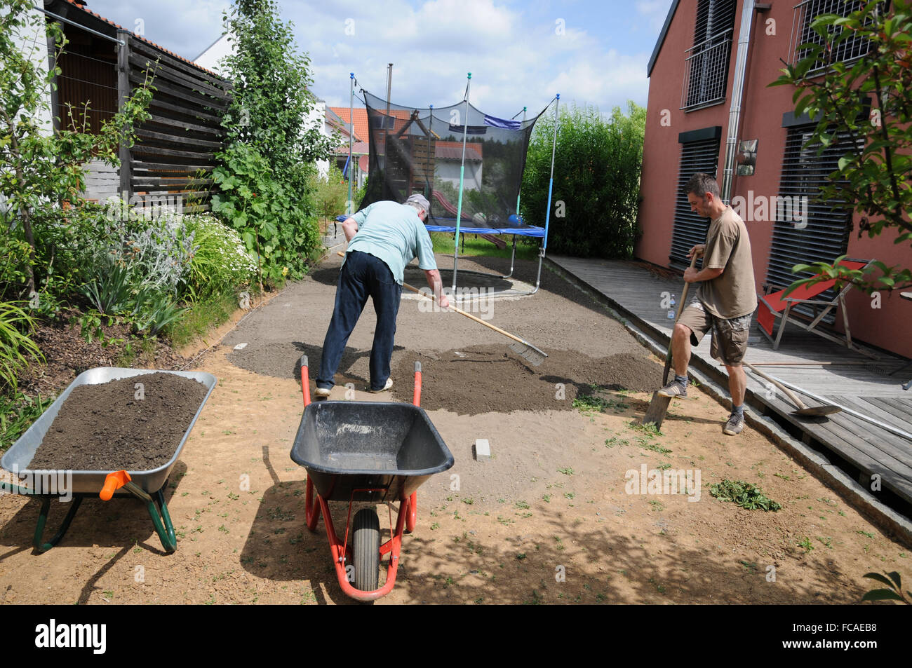 Laying sod, preparing soil Stock Photo - Alamy