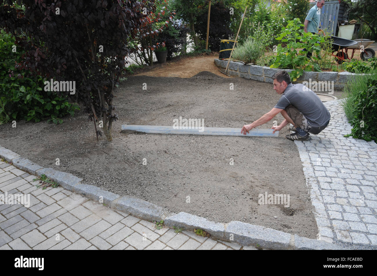 Laying sod, preparing soil Stock Photo - Alamy