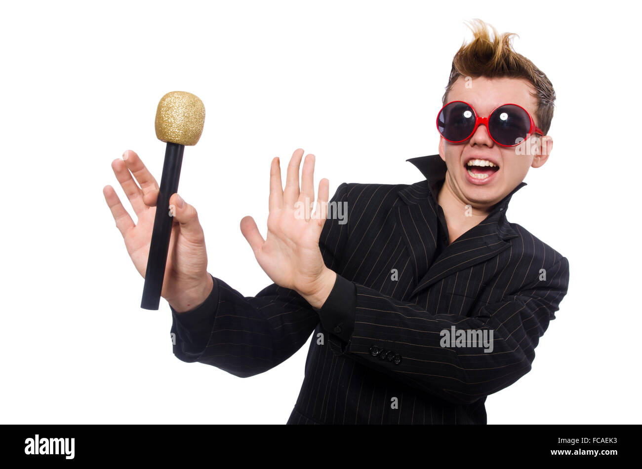 Singing man in karaoke concept Stock Photo - Alamy