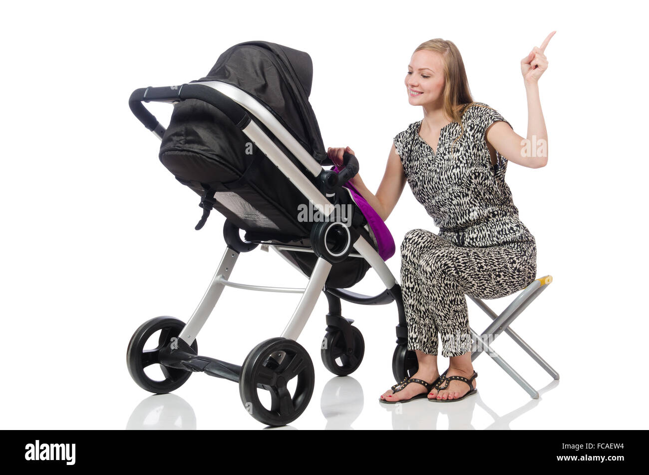 The happy mom with her baby in pram Stock Photo - Alamy