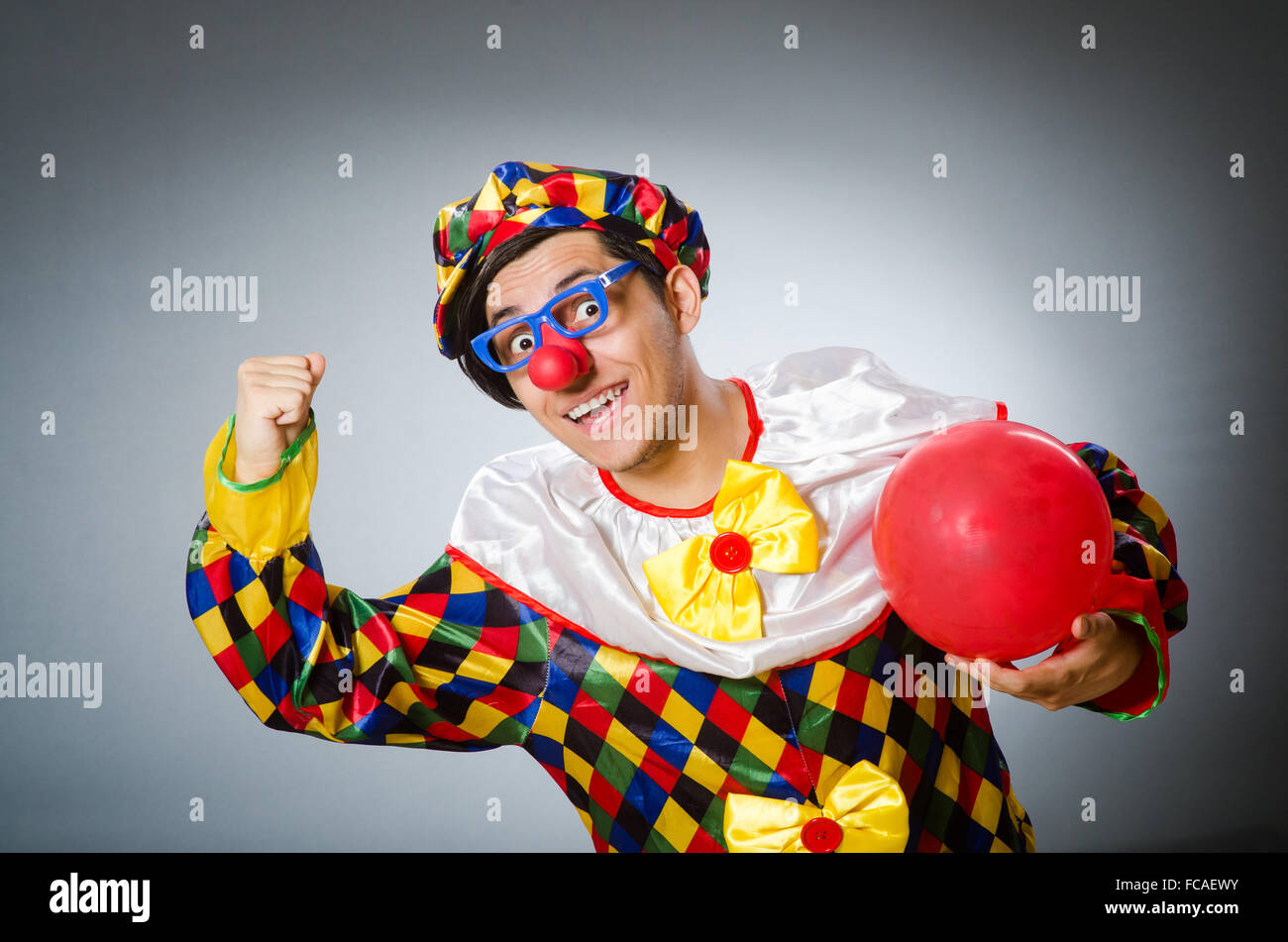 Funny clown in comical concept Stock Photo - Alamy